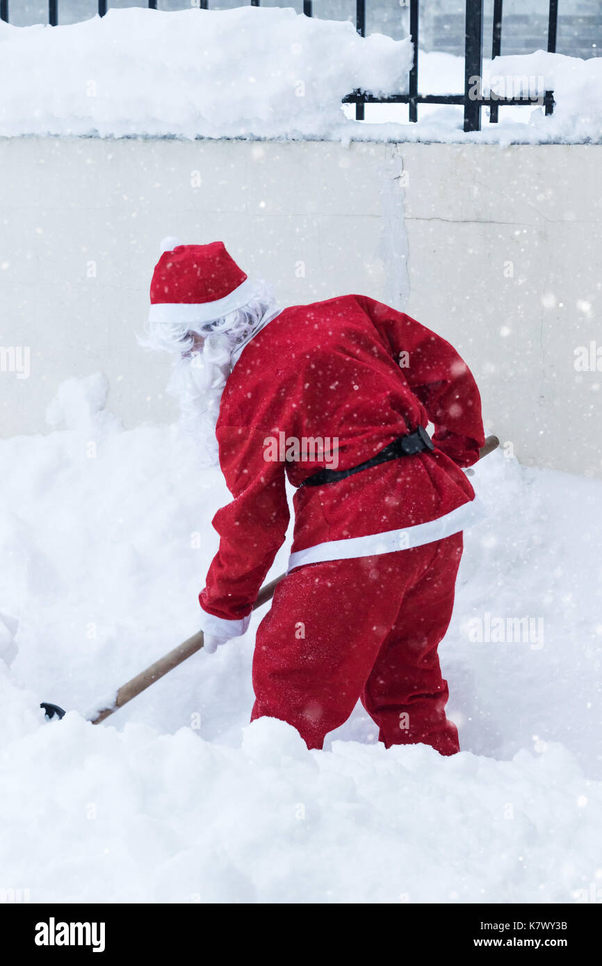 santa claus taking with shovel snow away to make the way free Stock ...