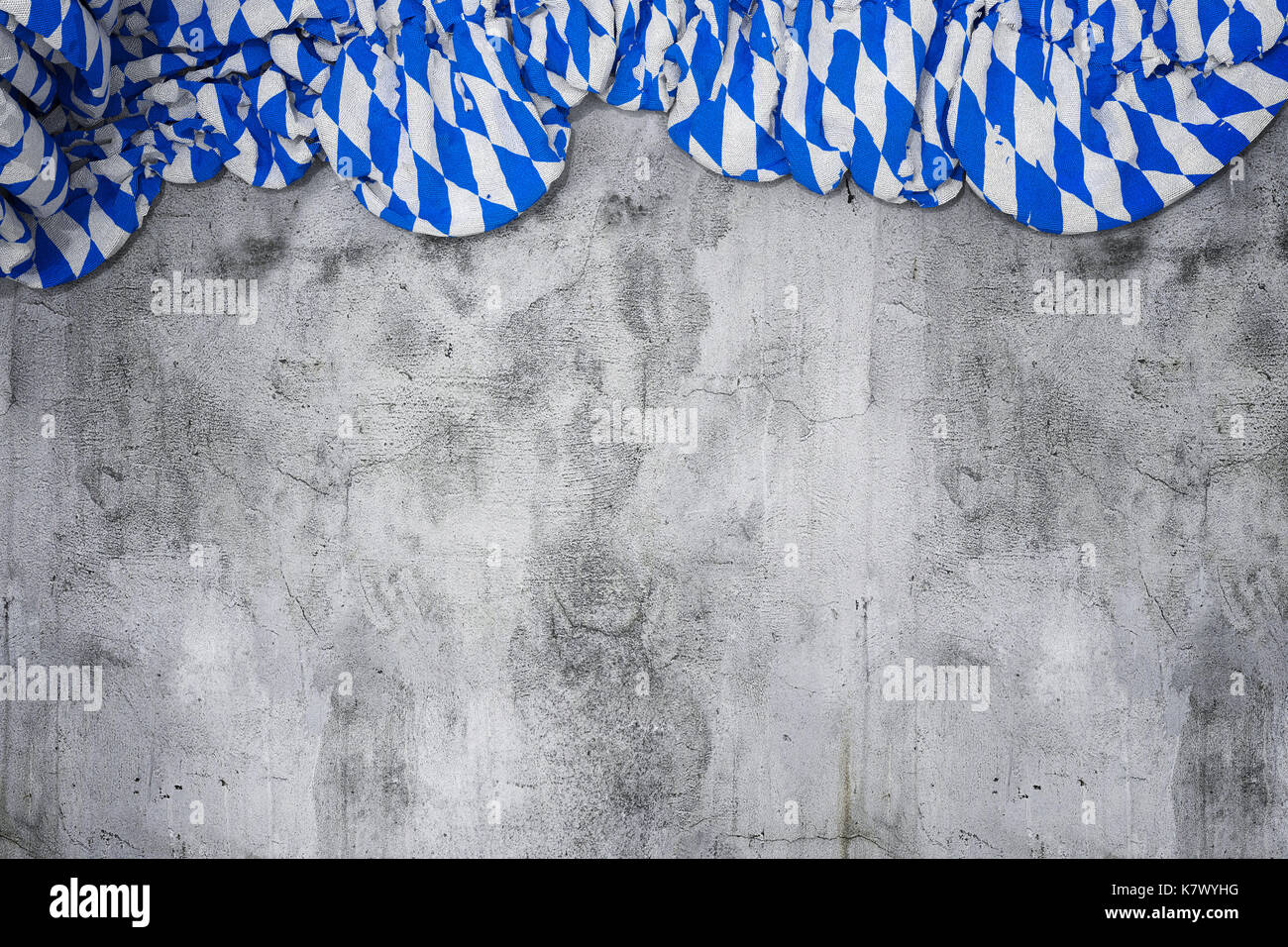 crumpled flag with bavarian colors of white and blue on empty concrete ...