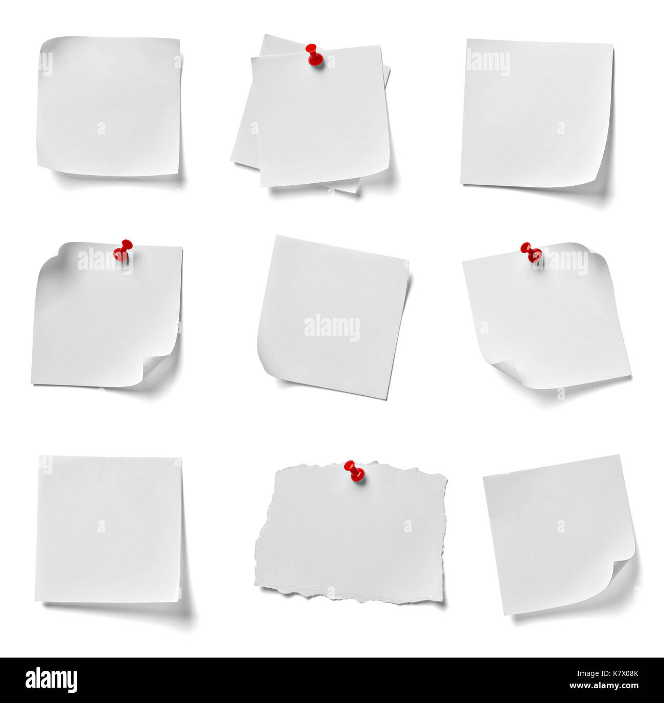 collection of various note paper with a red push pin on white ...