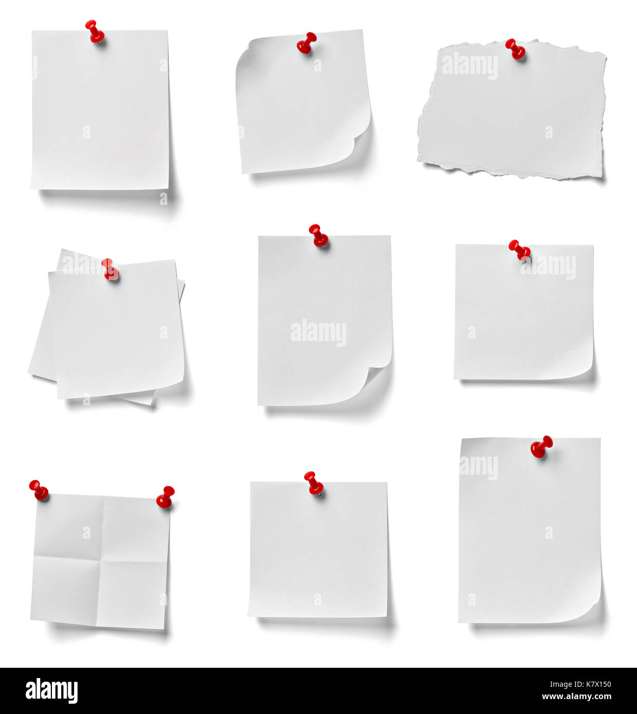 collection of various note paper with a red push pin on white ...