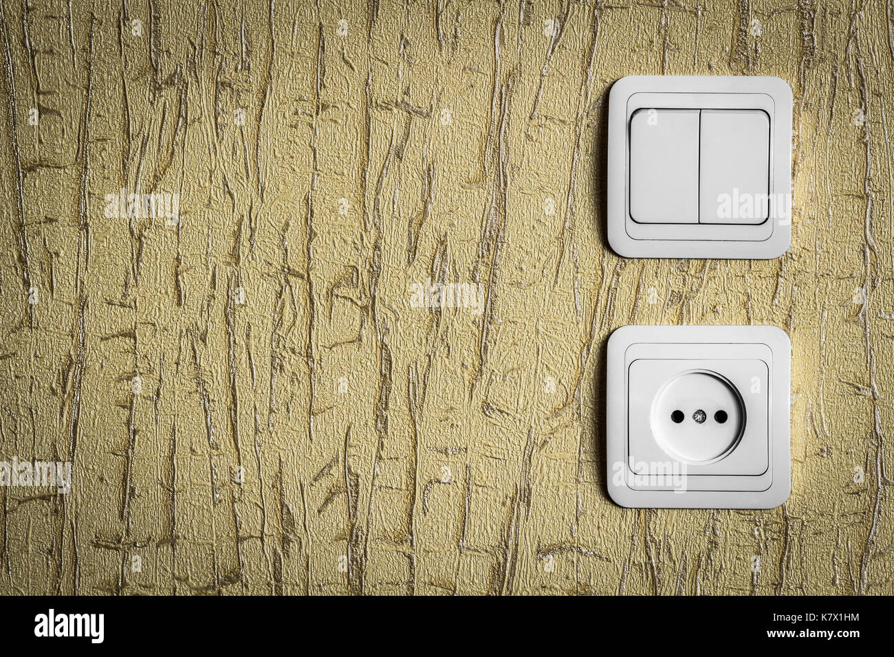 Wall Plastic electrical outlet and switch closeup Stock Photo - Alamy