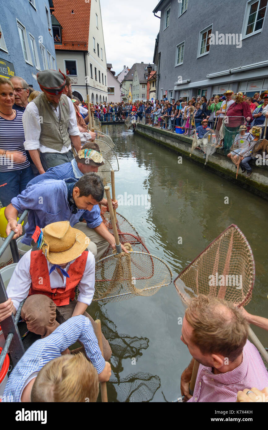Fischertag (fisher day): men and boys at the canal Stadtbach wait for ...
