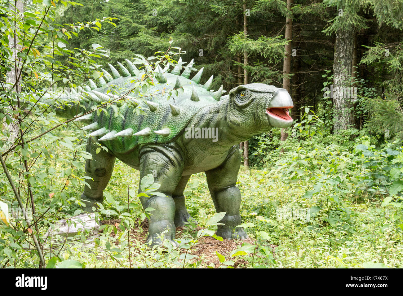 Statue of Talarurus dinosaur in a green forest Stock Photo - Alamy