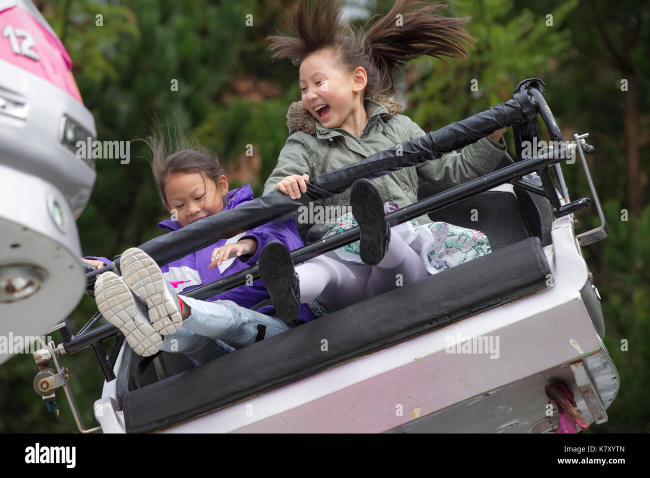 Children playing in fun fair Stock Photo - Alamy
