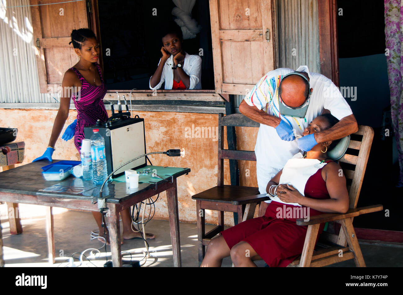 Volunteer Italian dentist at work with local Malagasy patients on his ...