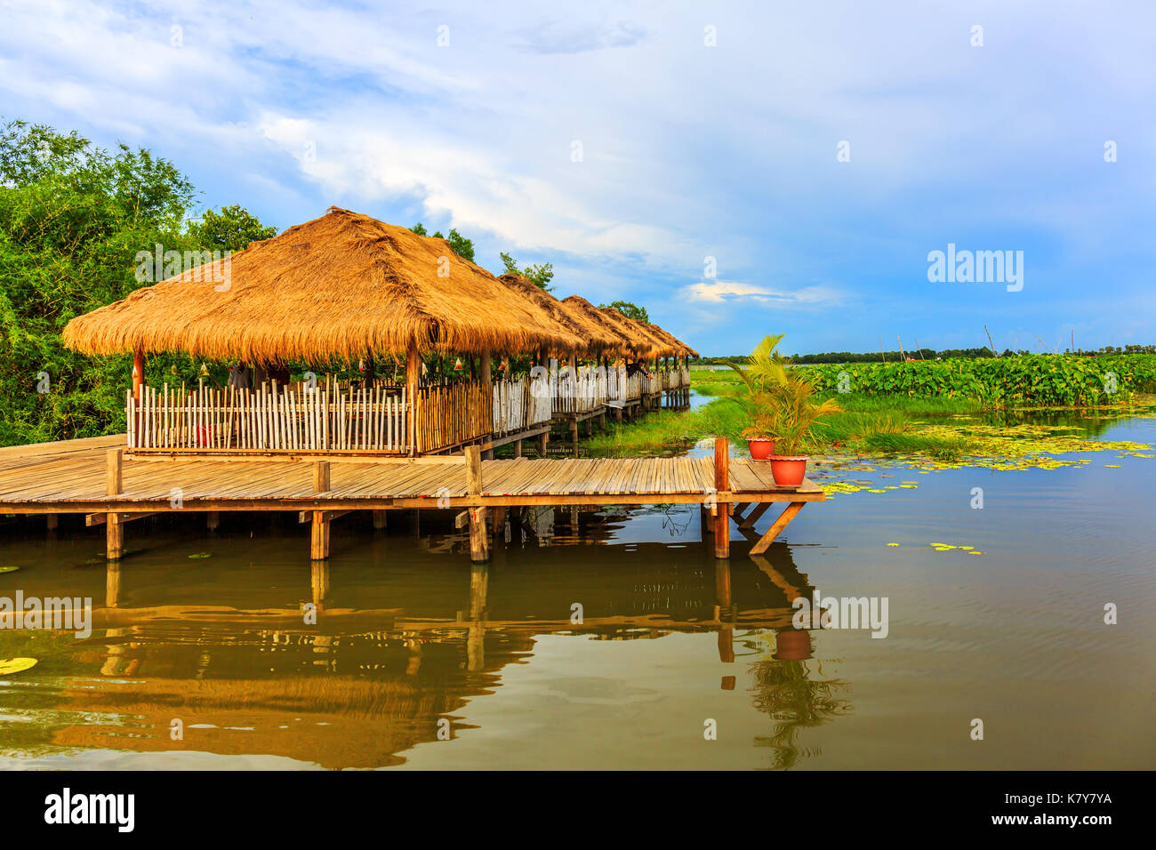 Nice Wooden Hut by a Lake Under a Clear Blue Sky Stock Photo - Alamy