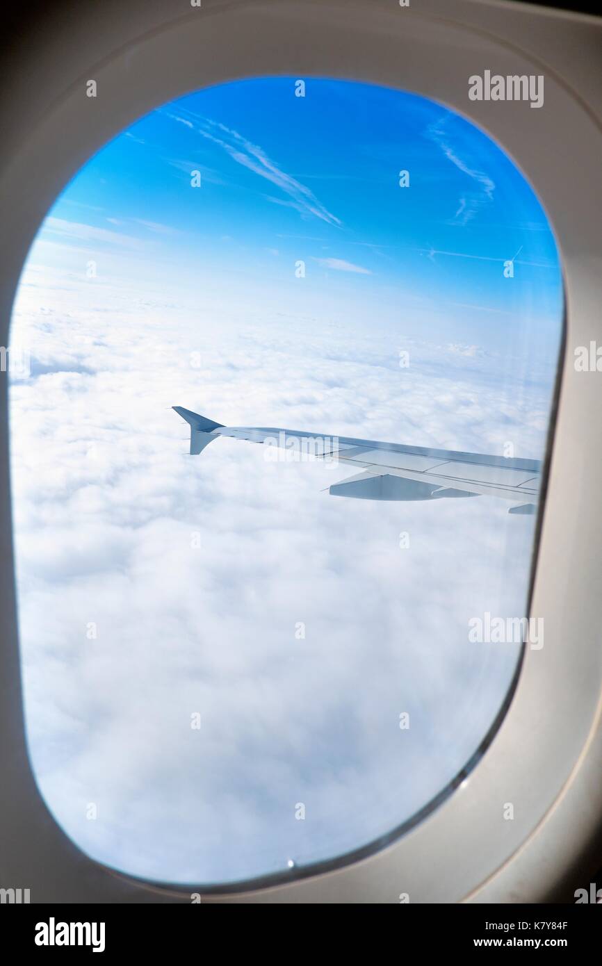 View from aircraft window of wing and white clouds Stock Photo - Alamy