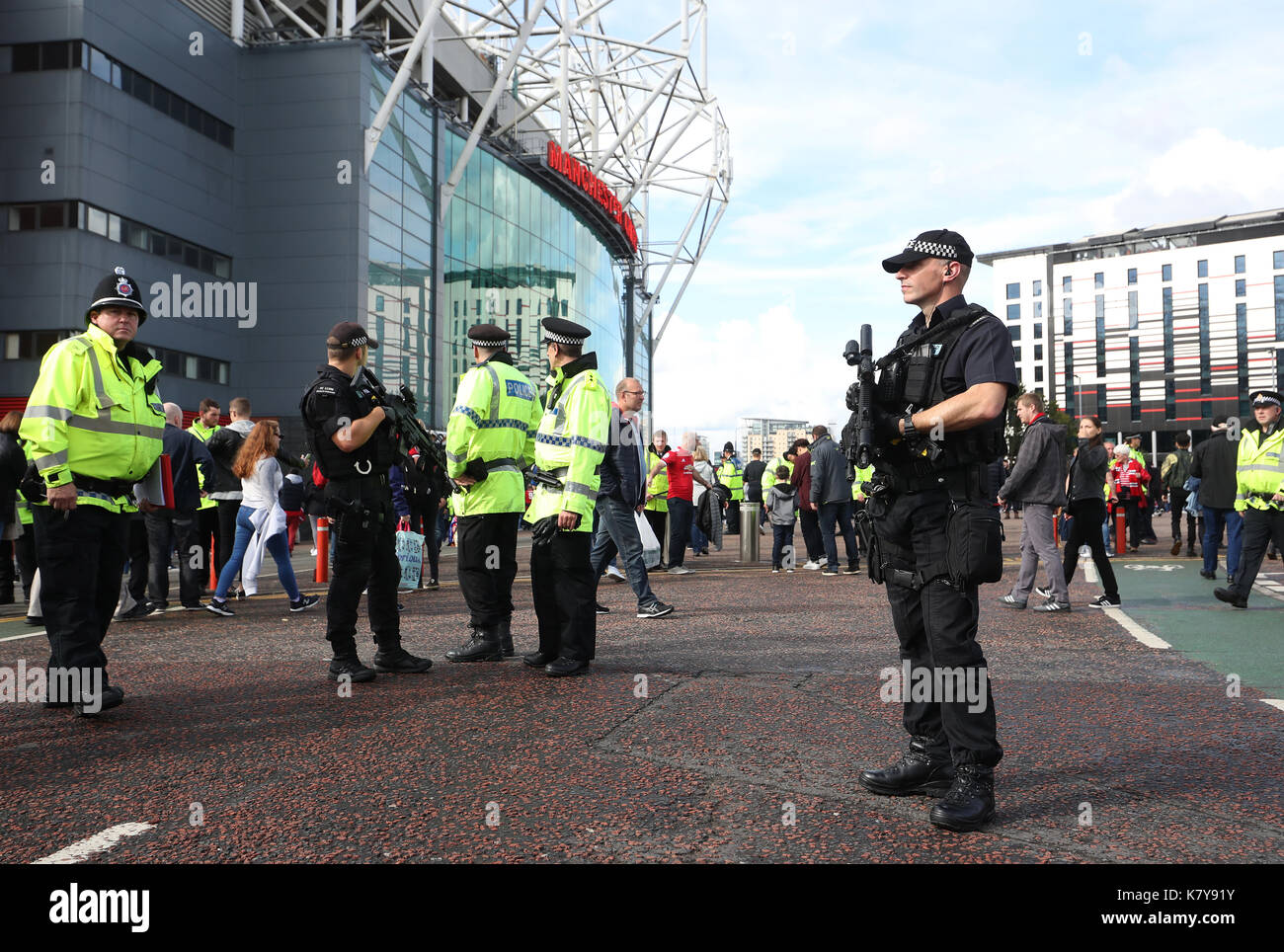 Armed police watch over fans outside the ground before the Premier ...