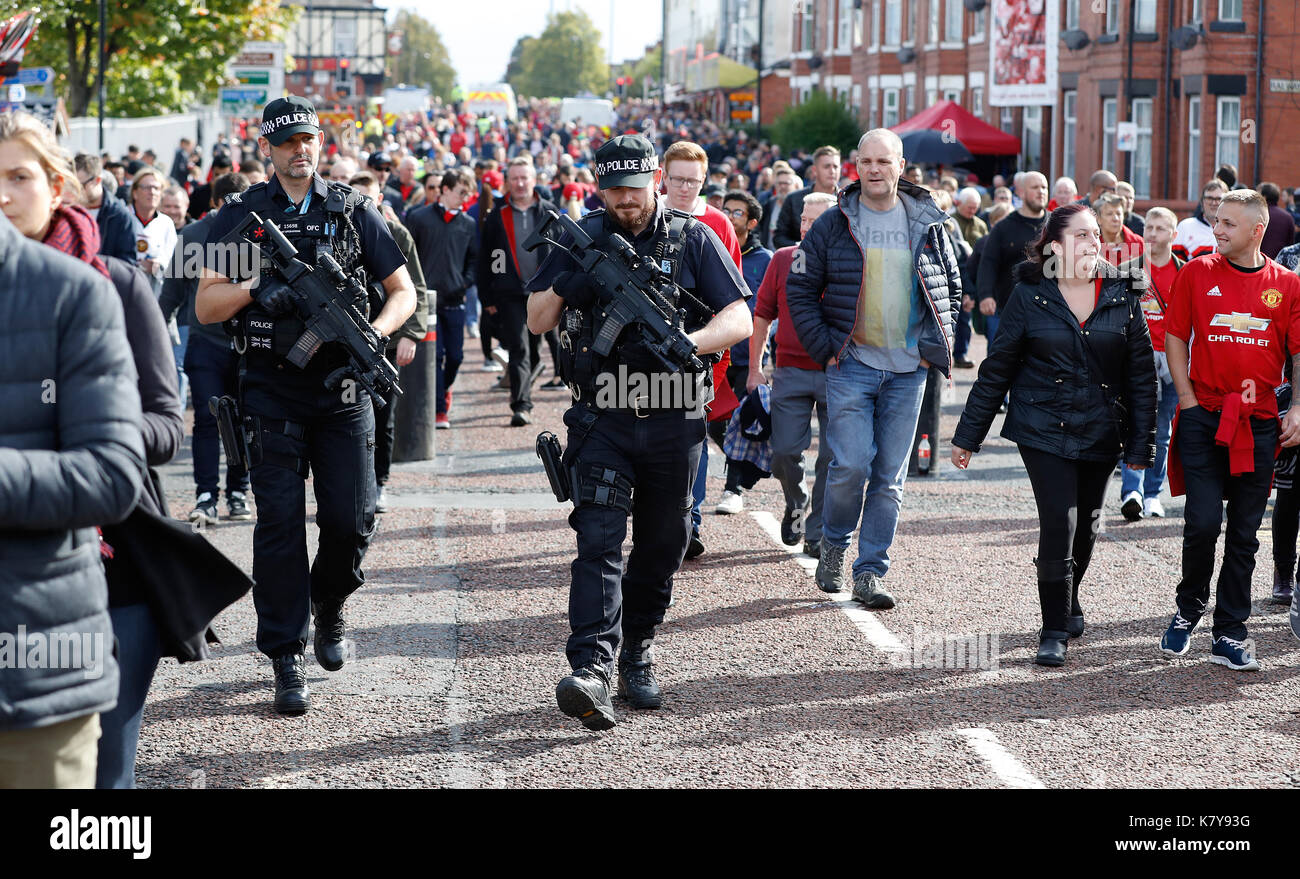 Armed police keep watch over fans outside the ground before the Premier ...