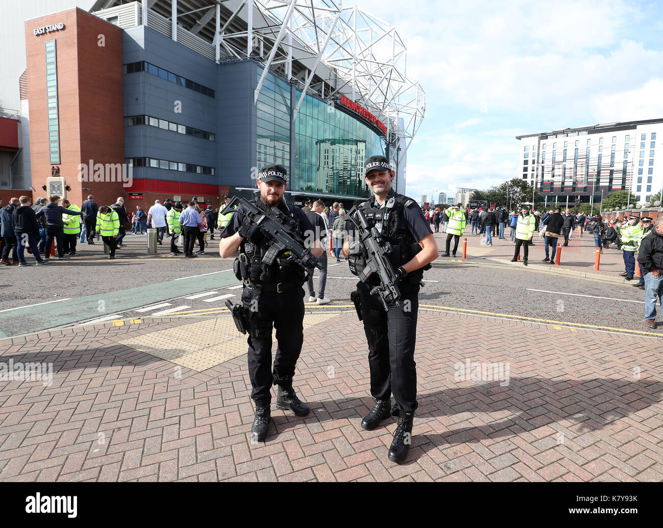Armed police keep watch over fans outside the ground before the Premier ...