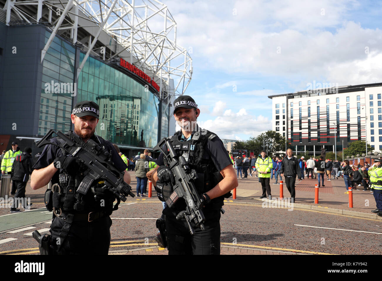 Police watch over fans outside ground hi-res stock photography and ...