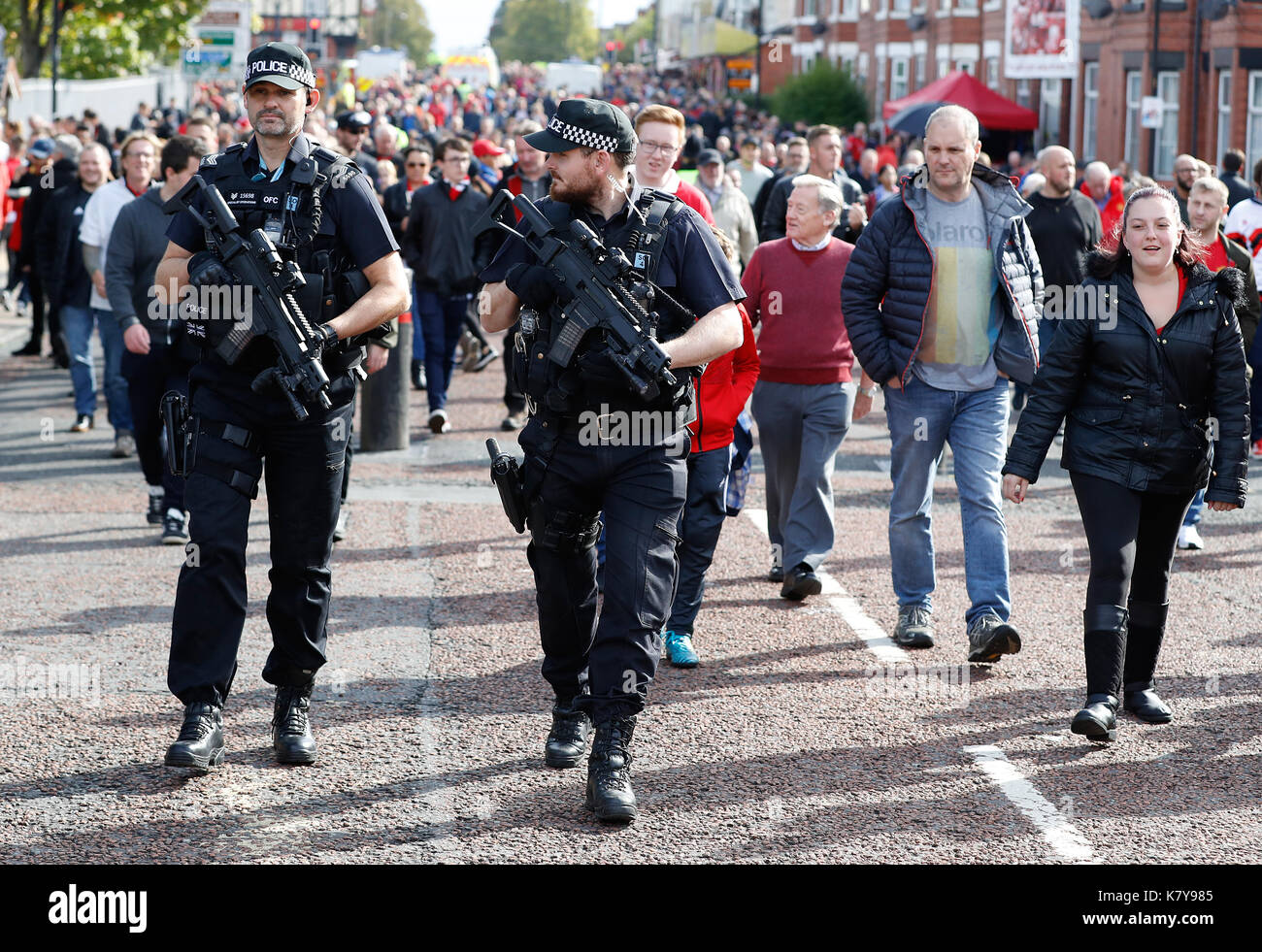 Armed police watch over fans outside the ground before the Premier ...