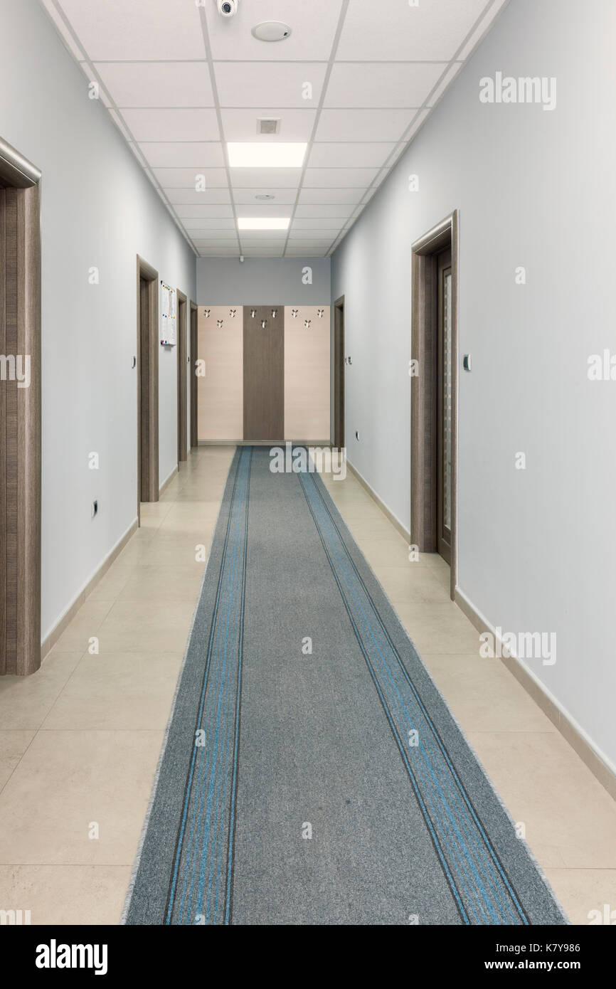 hallway with many wooden doors Stock Photo - Alamy