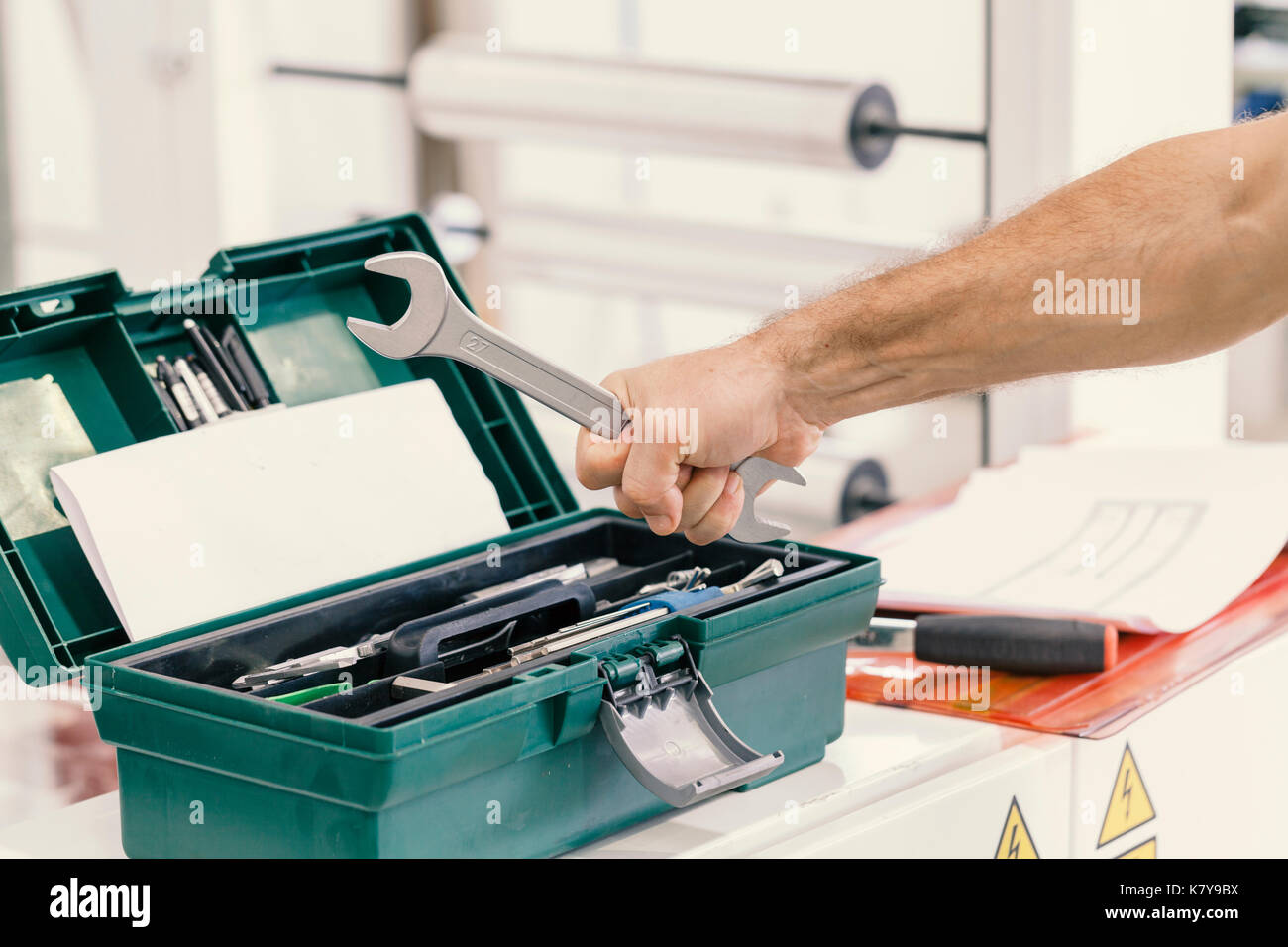 handyman takes tool from the toolbox Stock Photo - Alamy