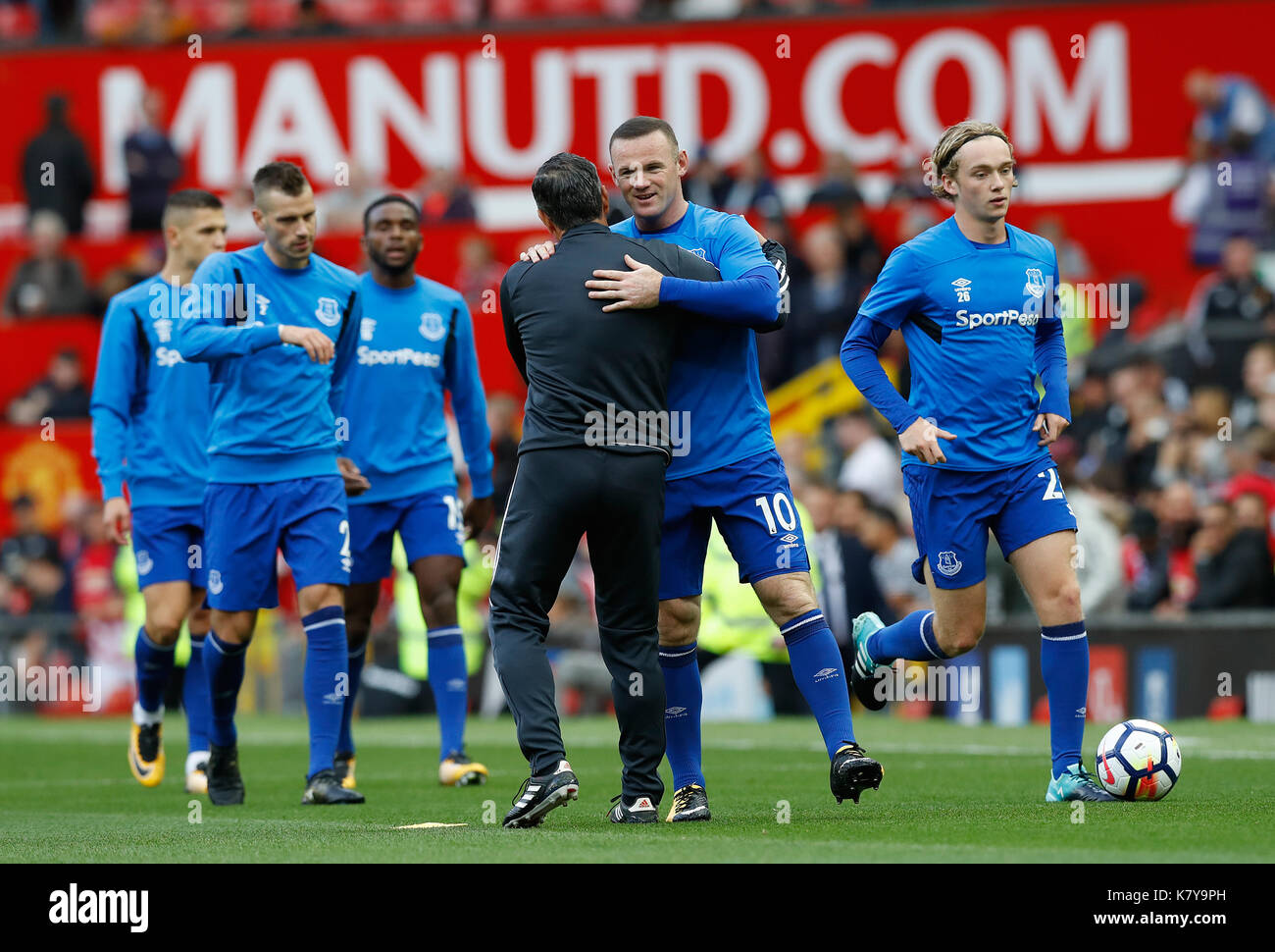 Everton's Wayne Rooney embraces Ricardo Formosinho, one of his former ...
