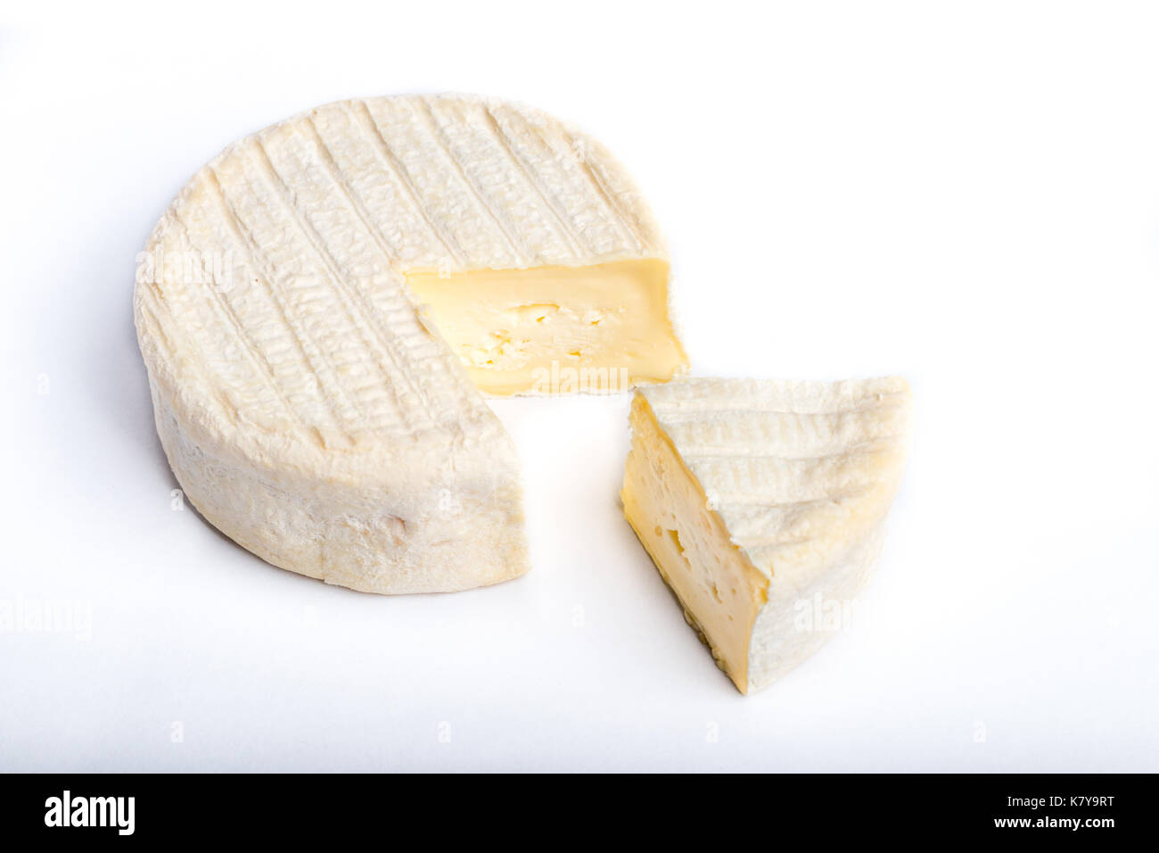 piece of french cheese on white background Stock Photo - Alamy