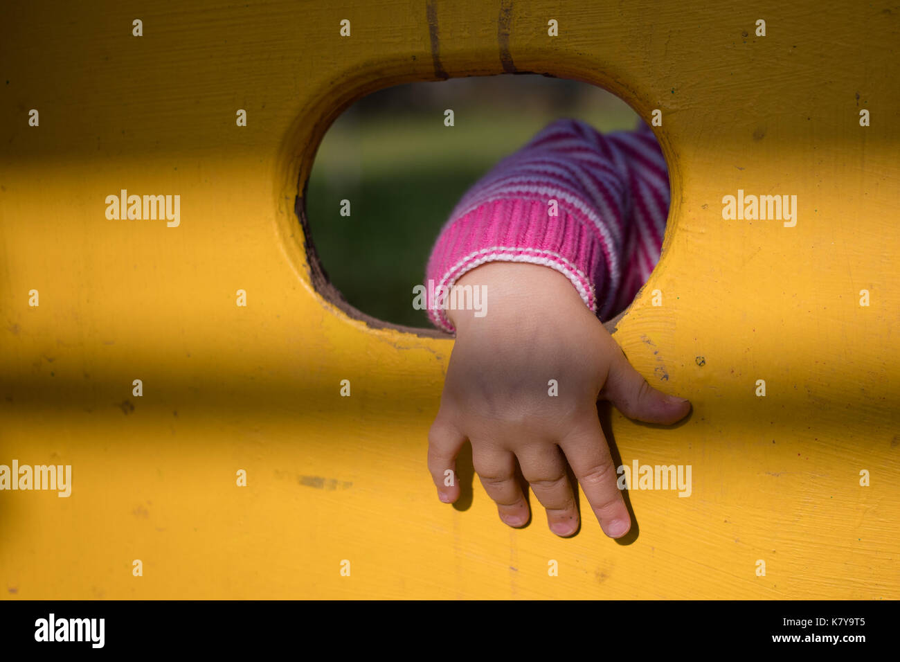 child's hand in a hole Stock Photo - Alamy
