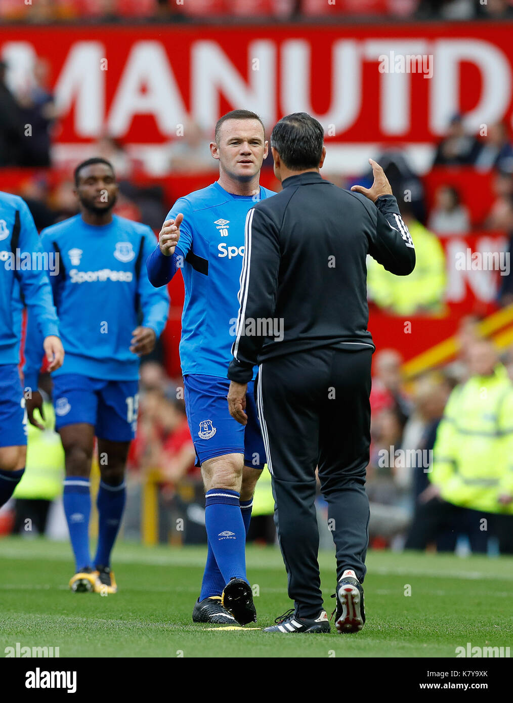 Everton's Wayne Rooney shakes hands with Ricardo Formosinho, one of his ...