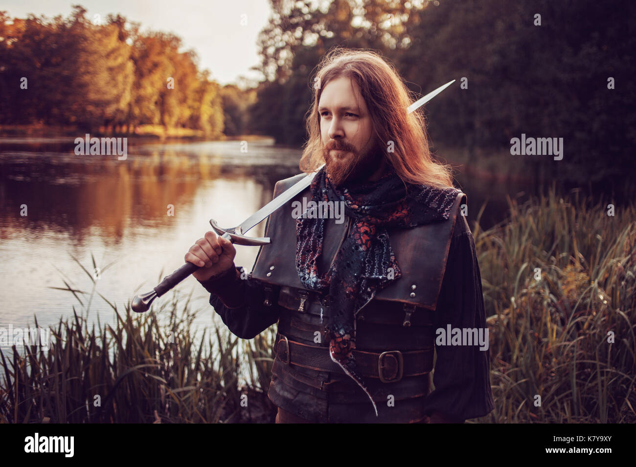 The bearded man knight. A guy in a medieval costume with a sword Stock ...