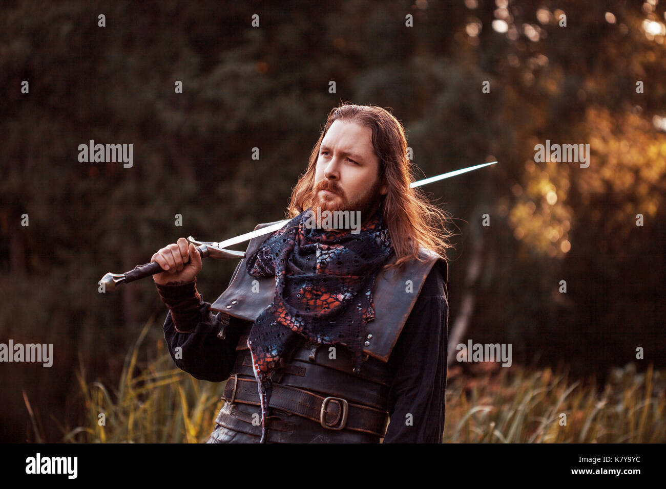 The bearded man knight. A guy in a medieval costume with a sword Stock ...