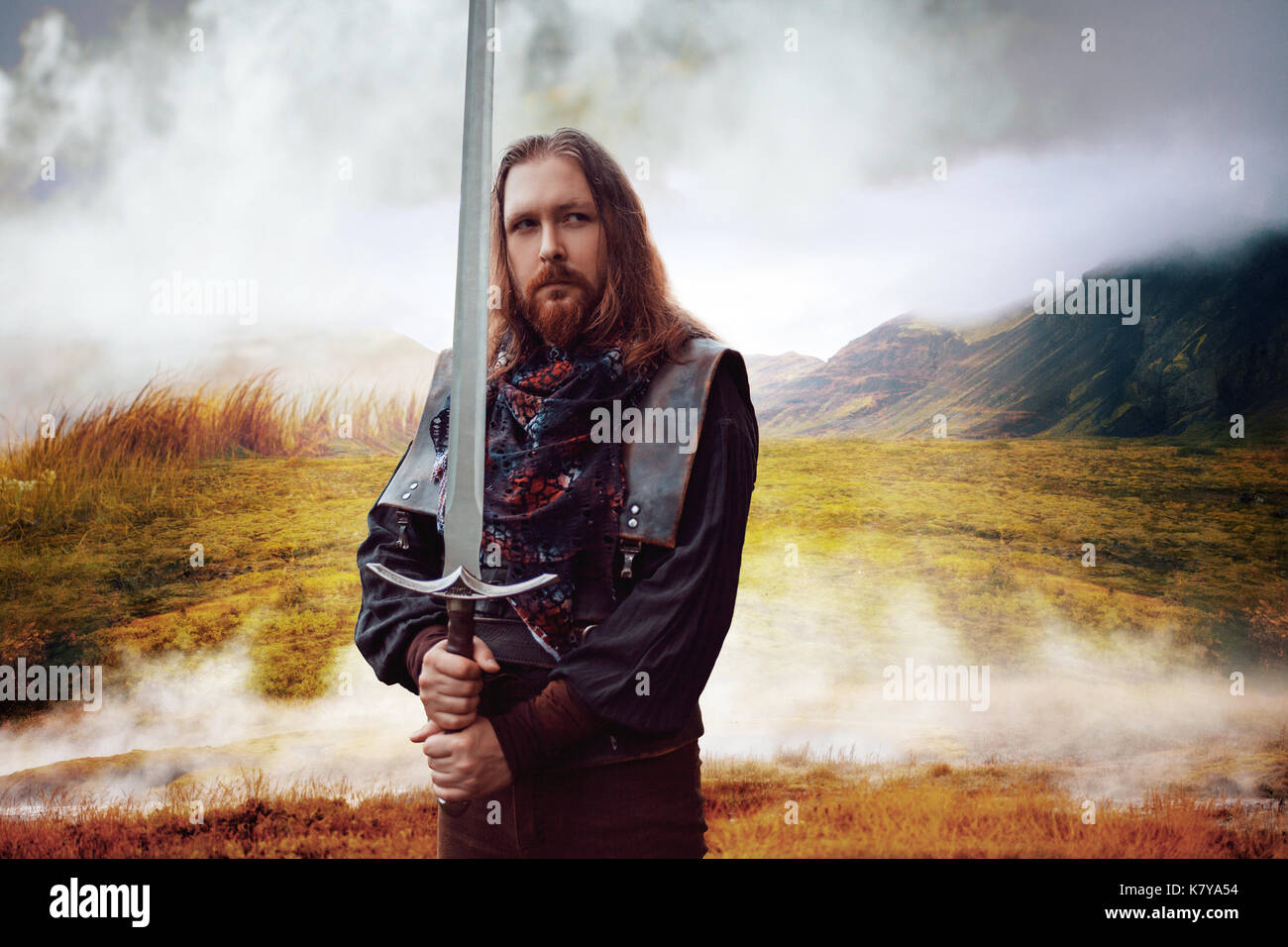 The bearded man knight. A guy in a medieval costume with a sword Stock ...