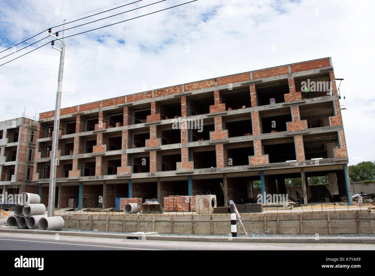 Asian thai workers and local machinery working builder new building at ...