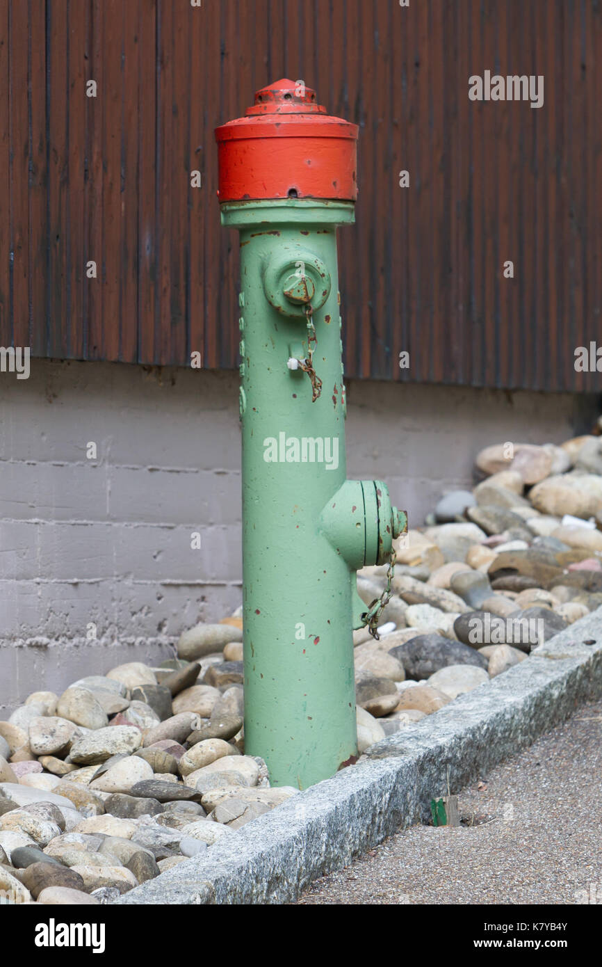 Green fire hydrant on a city sidewalk, Austria Stock Photo - Alamy