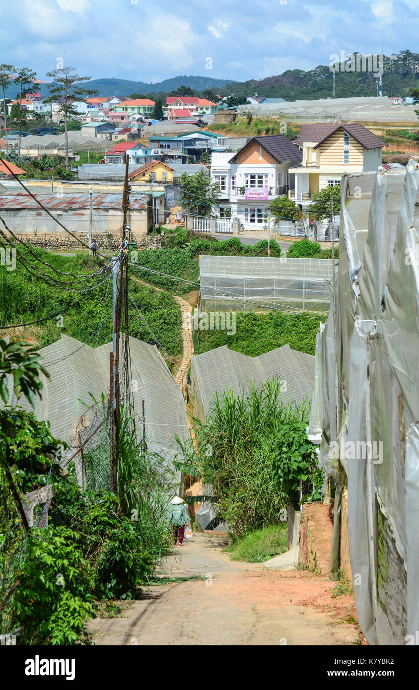 Dalat, Vietnam - Sep 21, 2015. People walking on rural road in Dalat ...