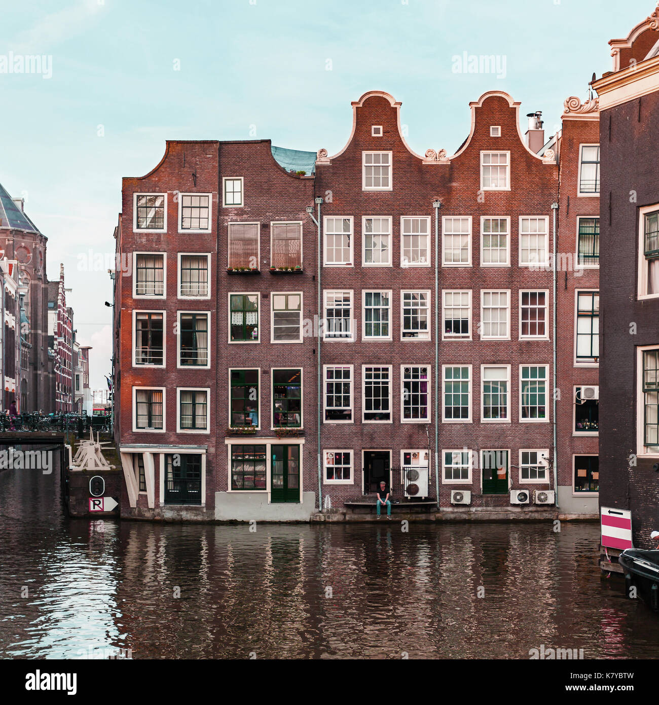 Typical street in Amsterdam with canal and colorful houses. Netherlands ...