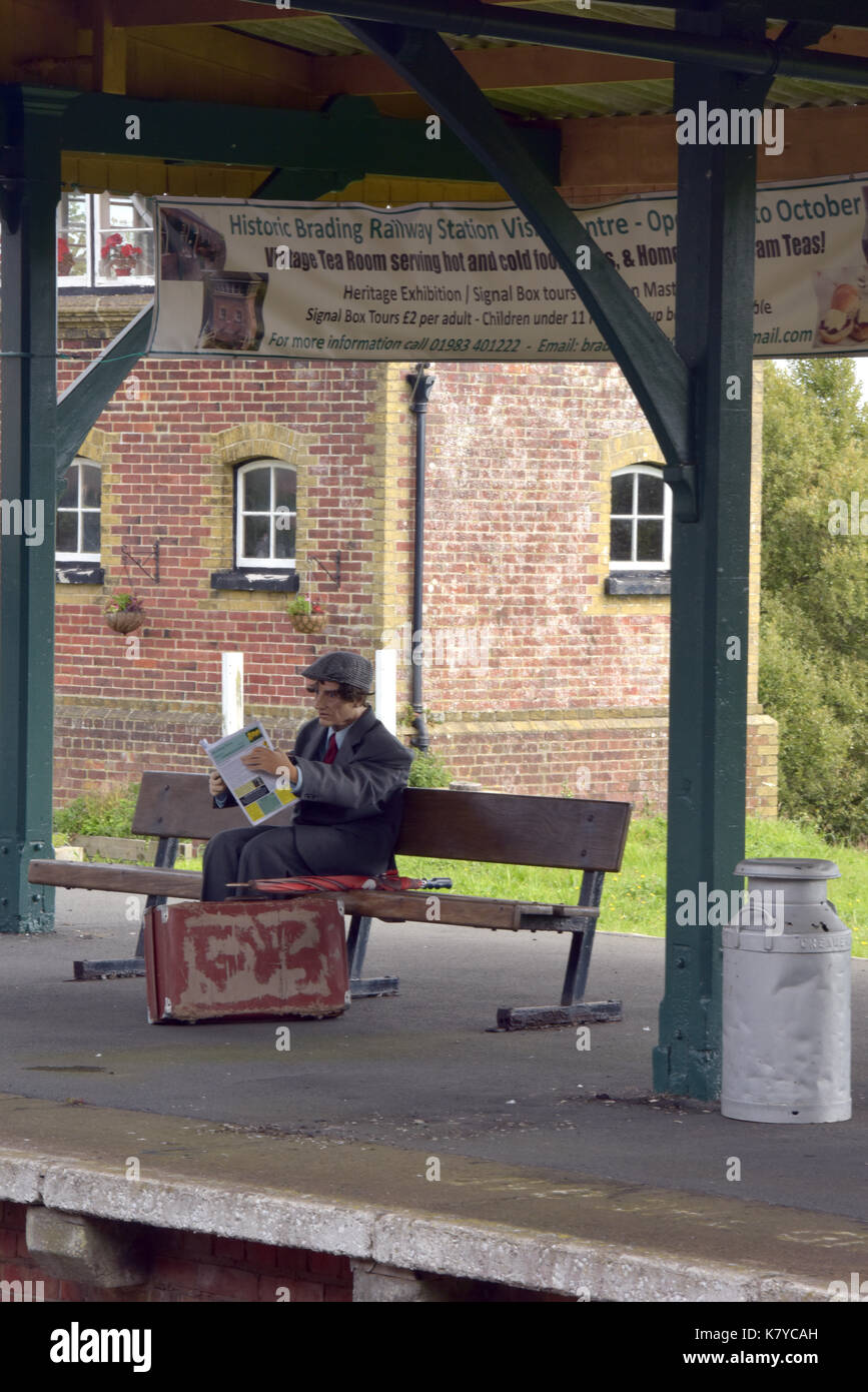 a mannequin on a railway station platform at a museum of trains on the ...