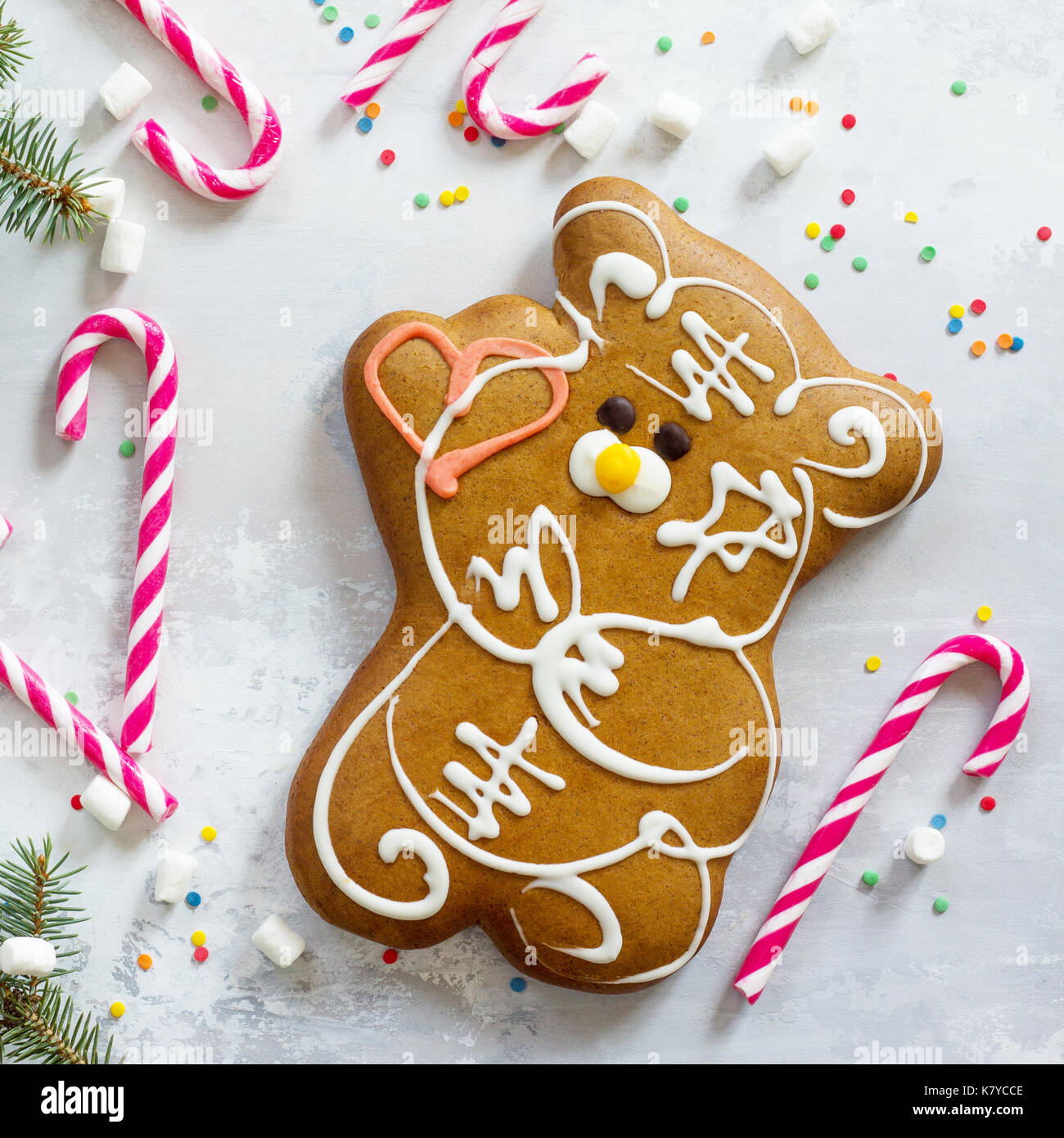 Christmas background with gingerbread bear and holiday decorations on a ...