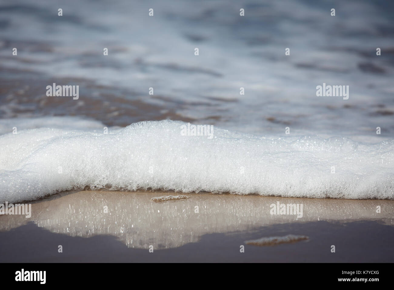 Sea foam on the tide of the Irish Sea at Formby, England Stock Photo ...