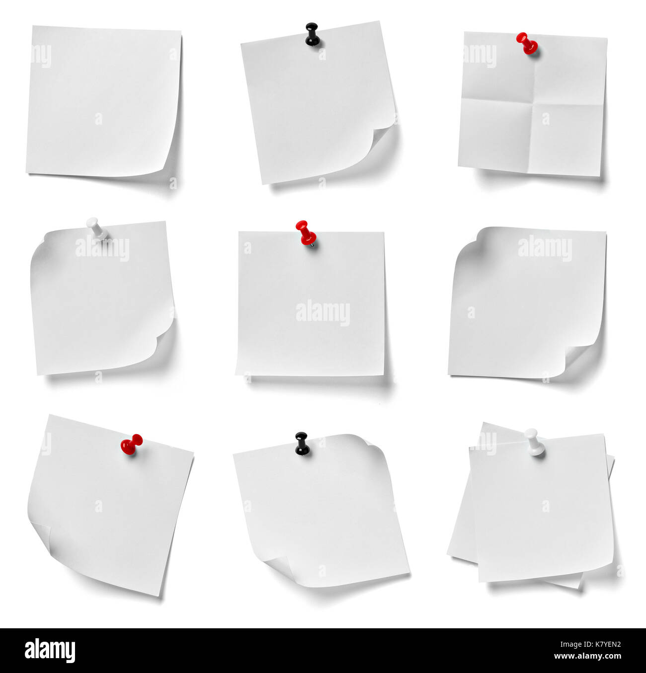 collection of various note paper with a red push pin on white ...