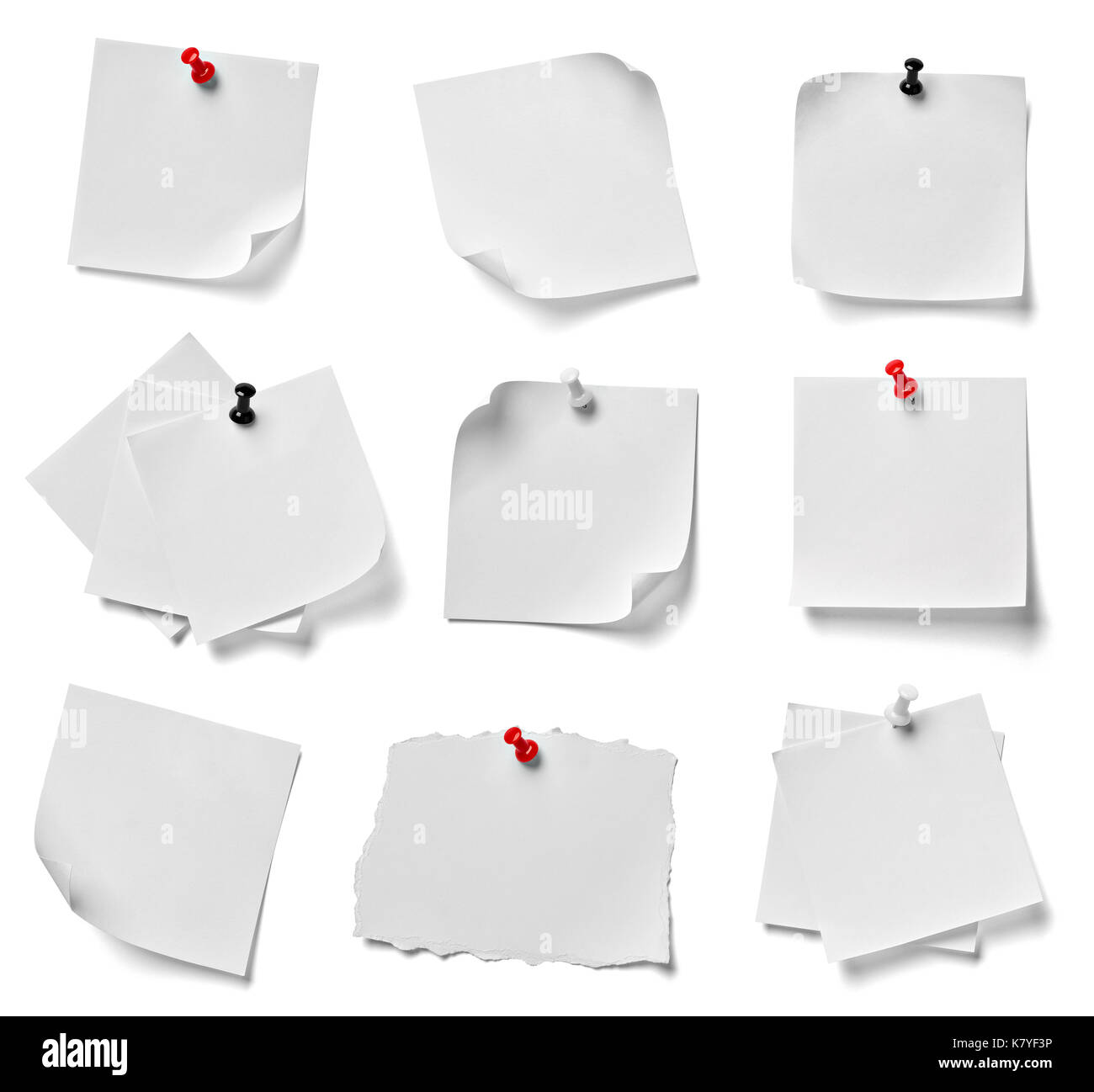 collection of various note paper with a red push pin on white ...