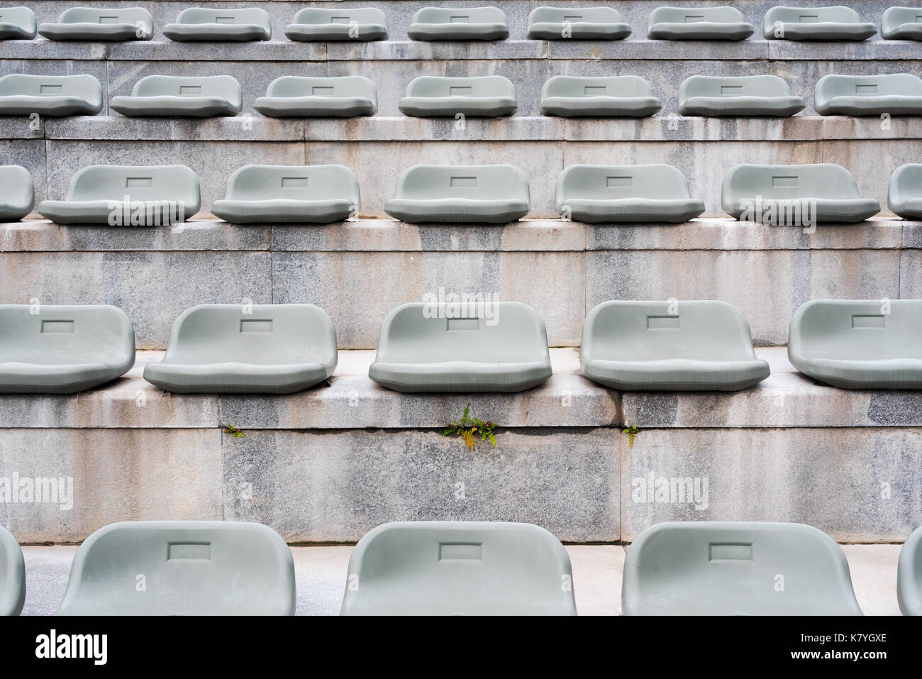 Empty gray stadium seats Stock Photo - Alamy