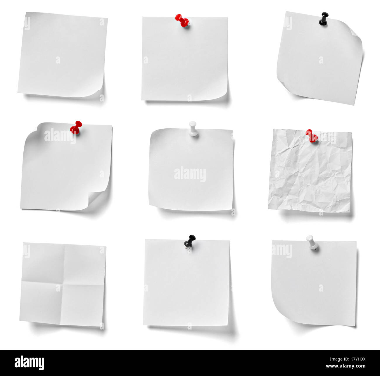 collection of various note paper with a red push pin on white ...