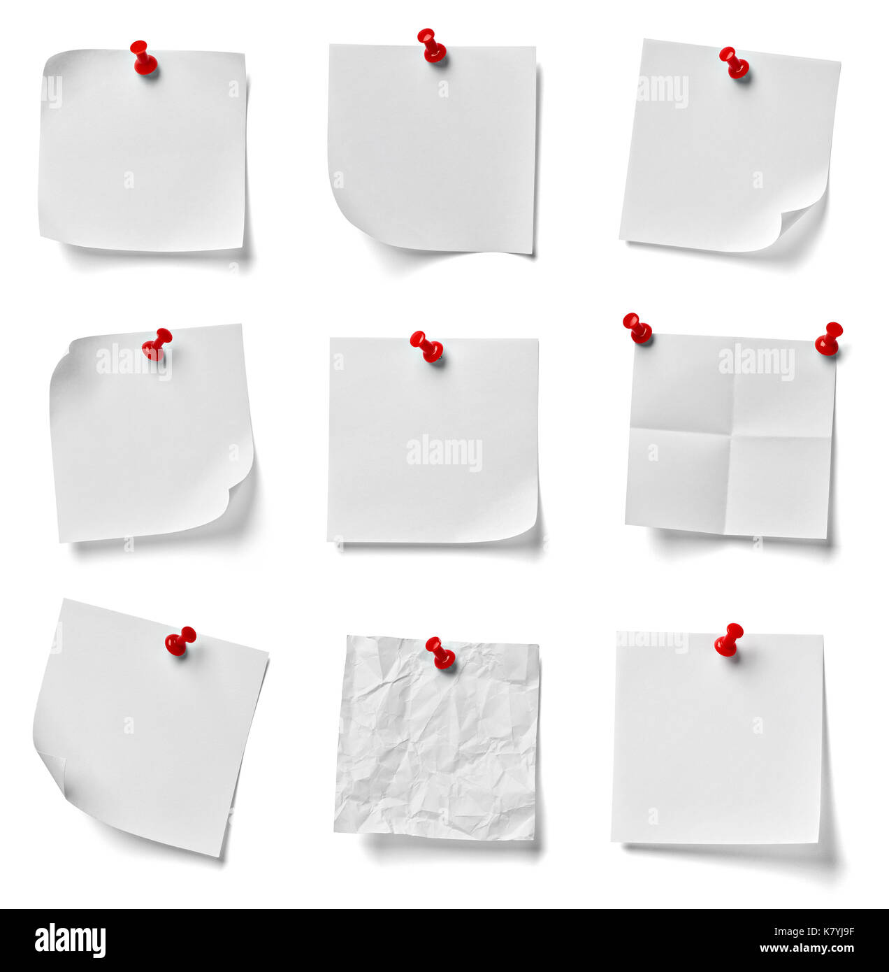 collection of various note paper with a red push pin on white ...