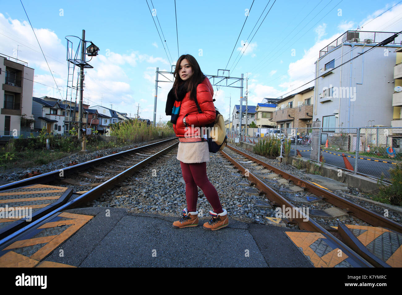 cool girl walk through the railway Stock Photo - Alamy