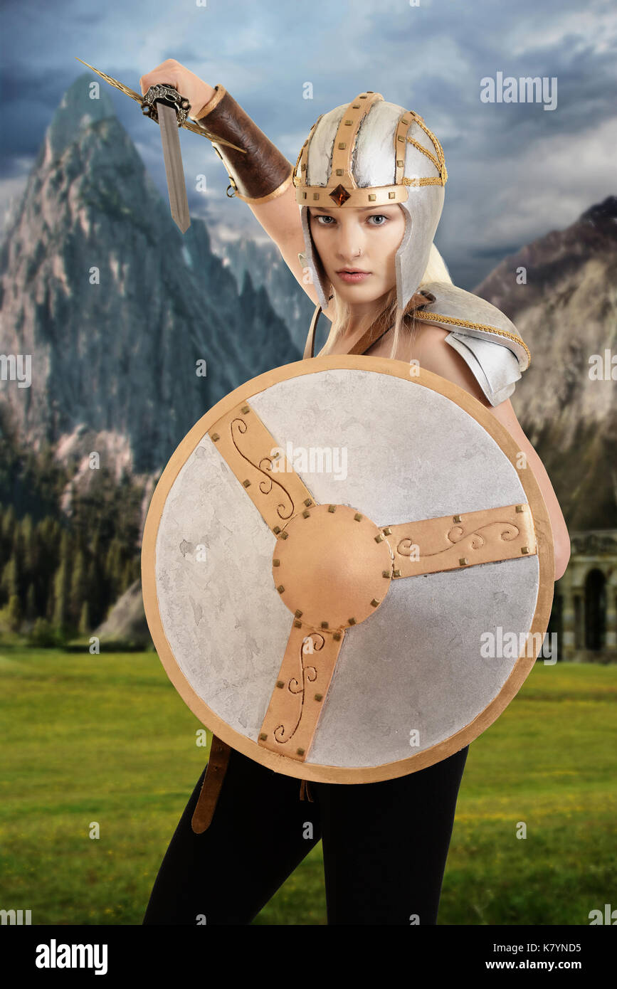 female warrior attacking with shield and sword Stock Photo - Alamy