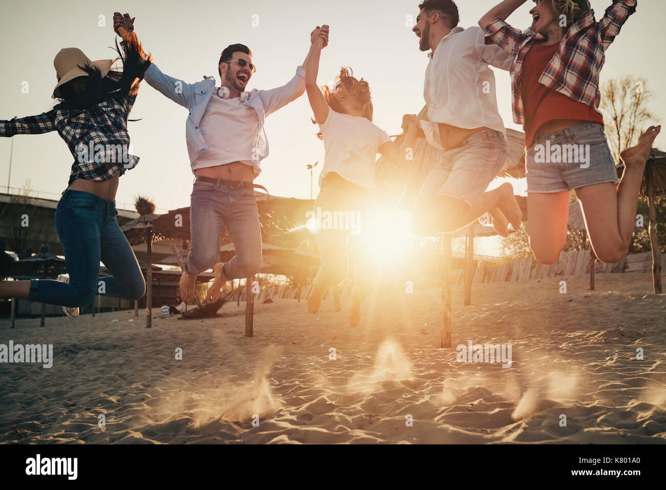Group of happy young people enjoying summer vacation Stock Photo - Alamy