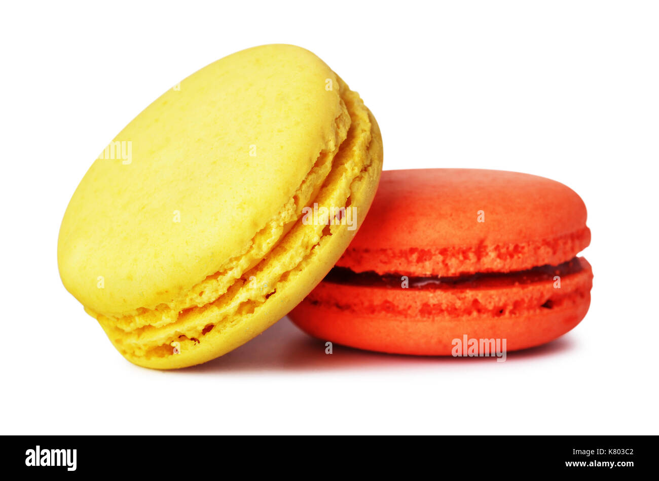 Two orange and yellow macaroon isolated on white background Stock Photo ...