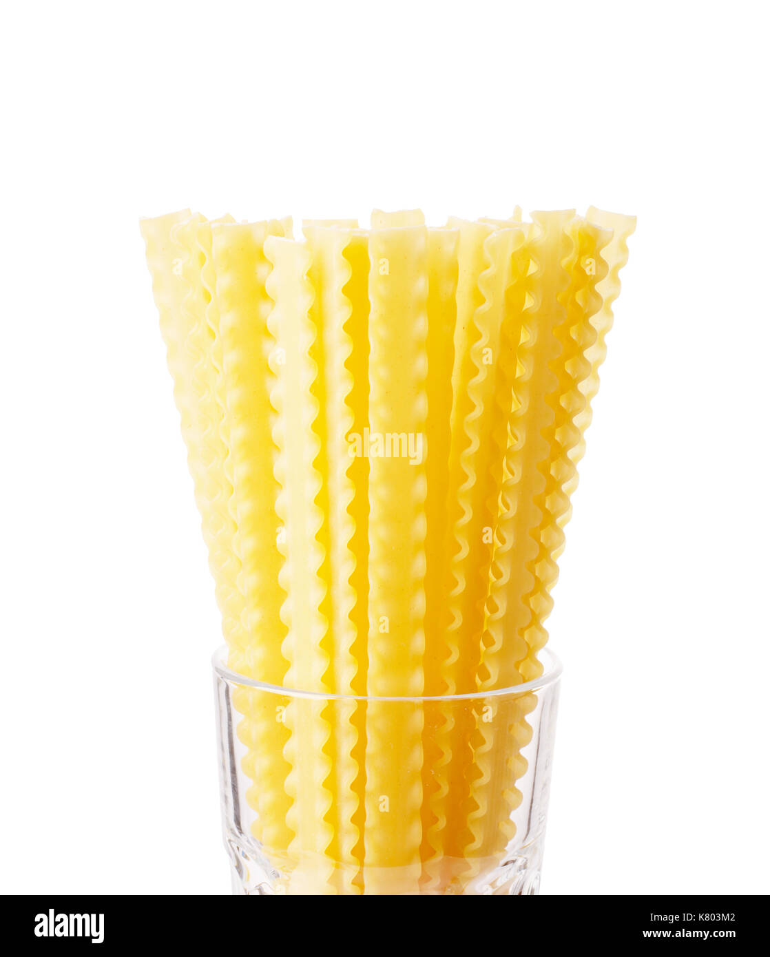 Long wavy wide spaghetti in a glass isolated on white background Stock ...