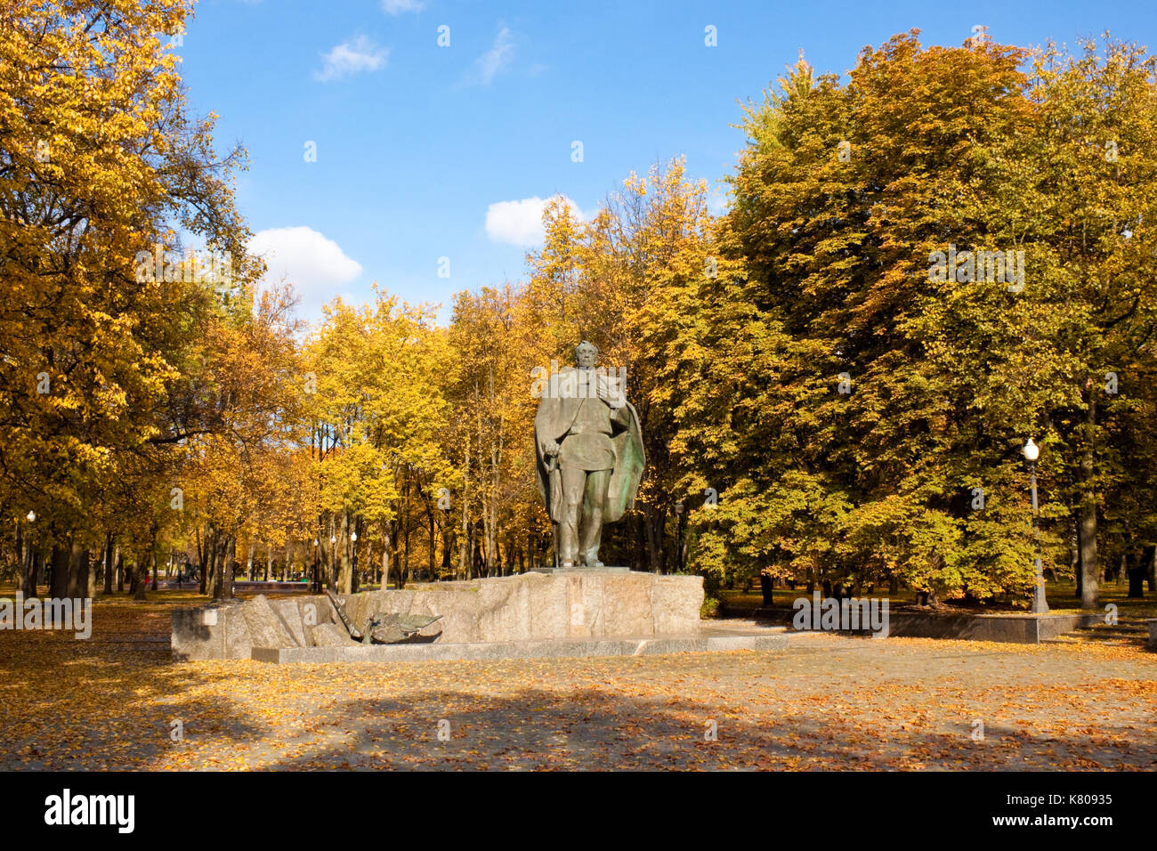 Statue of a great belarusian writer Janka Kupala in bright autumn park ...