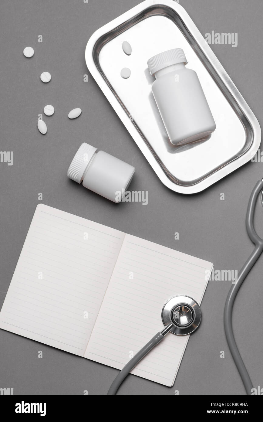 Top view of doctor desk table with stethoscope and medical items. Flat ...