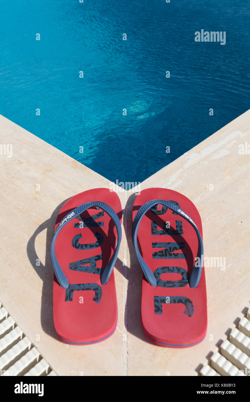 Flip Flops By Side of Pool Stock Photo - Alamy