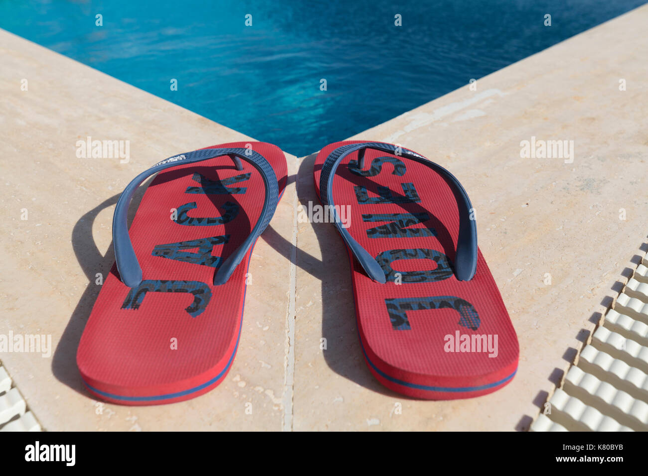 Flip Flops By Side of Pool Stock Photo - Alamy