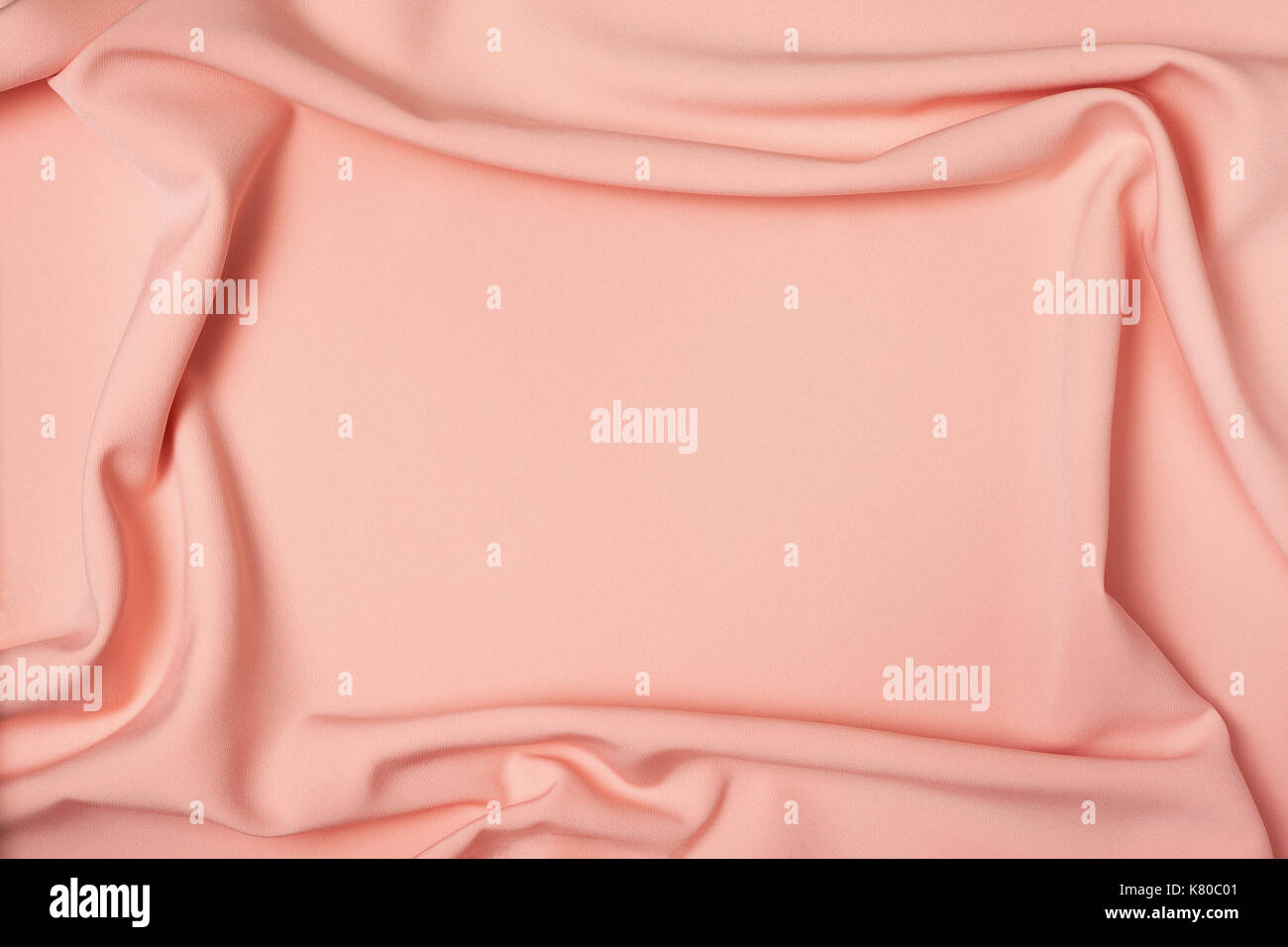 background of peach fabric draping close-up Stock Photo - Alamy