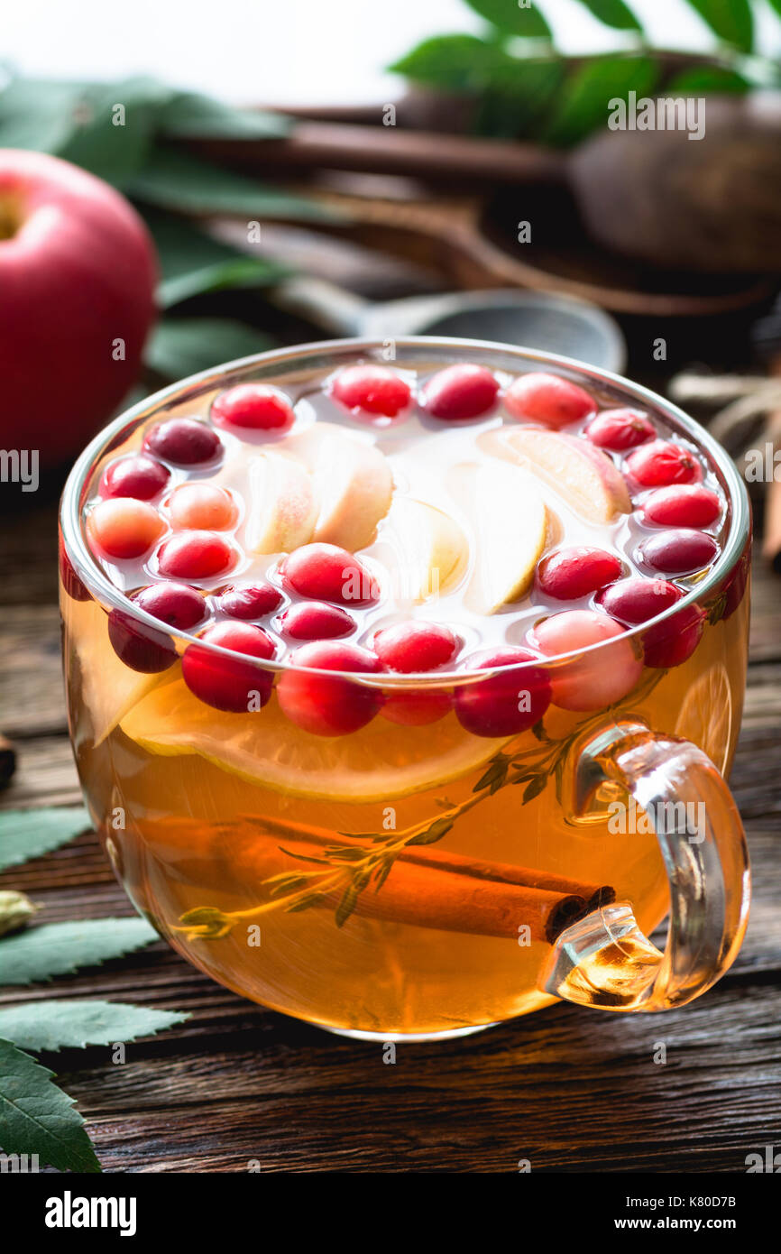 Herbs and spices infused warming tea for cold winter days in glass cup ...