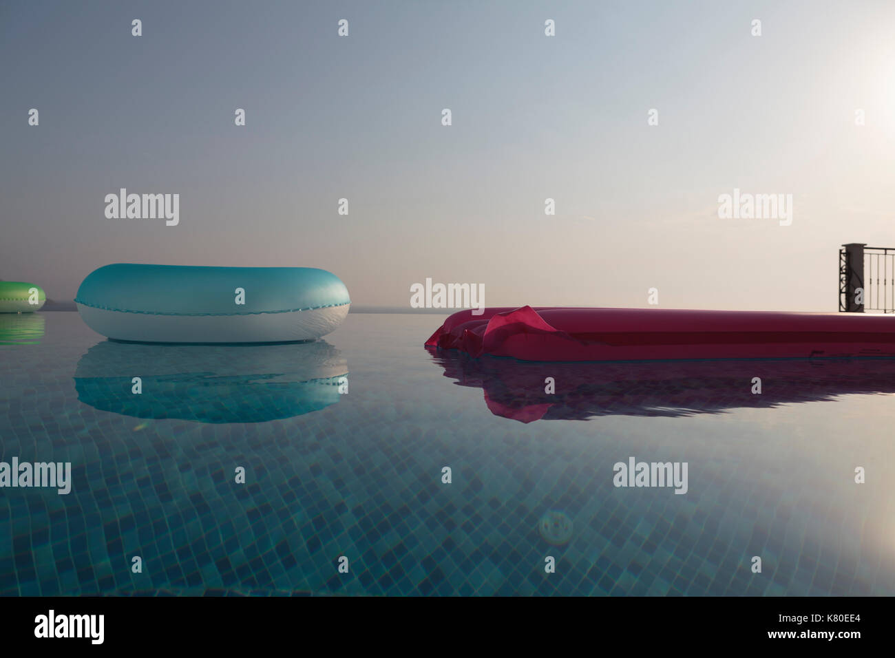 Lie Low and floating rings in swimming pool Stock Photo - Alamy