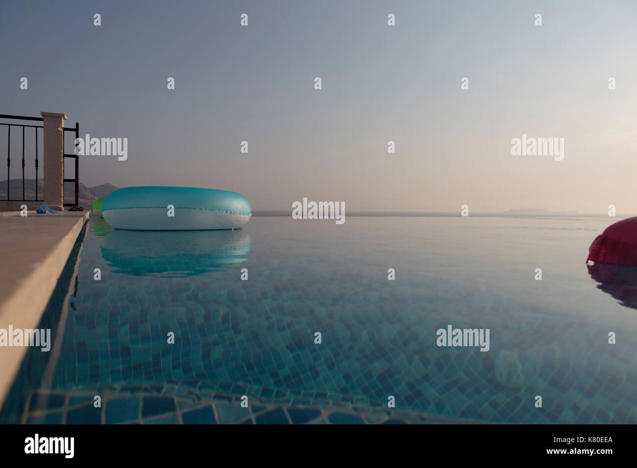 Lie Low and floating rings in swimming pool Stock Photo - Alamy